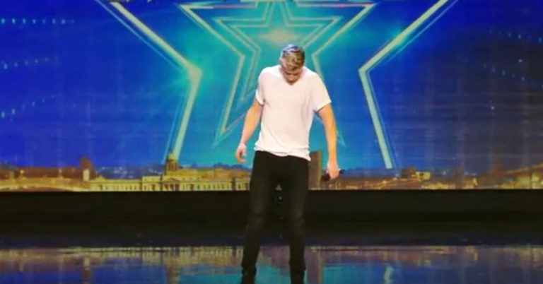 Nervous man stands alone on stage, but when he opens his mouth he shuts ...