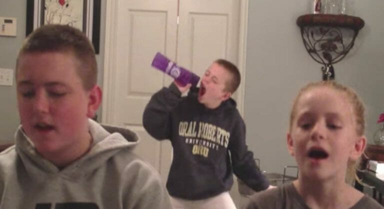 Brother and sister sing heartbreaking duet, but watch who's lurking ...